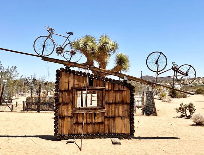 Welcome to the Twilight Zone of art! This arched entrance beckons you into a world where creativity knows no bounds and junk becomes genius.