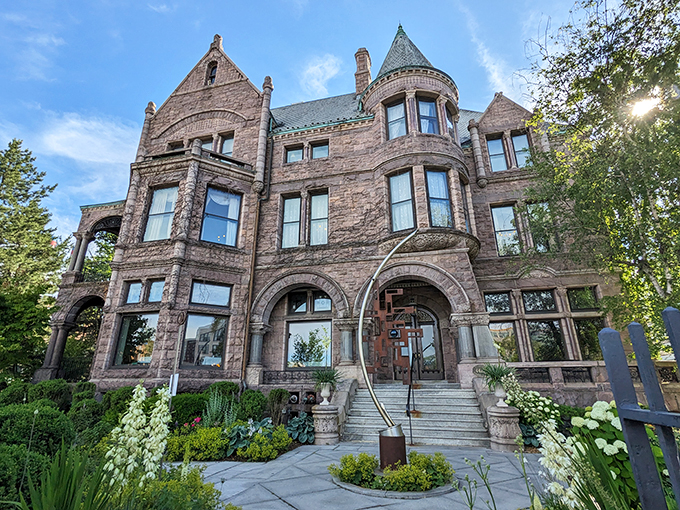 A castle fit for a lumber baron! The Whitney's grand exterior whispers tales of Gilded Age opulence and modern culinary delights.