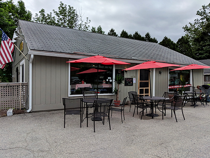 Welcome to pizza paradise! Sam's Wood Fired Pizza stands proud against the Vermont sky, promising delicious adventures within its humble walls.