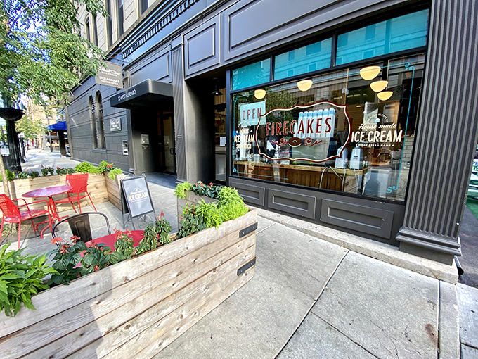 A teal oasis in the concrete jungle! Firecakes Donuts beckons with its charming storefront, promising sweet salvation for weary urbanites.