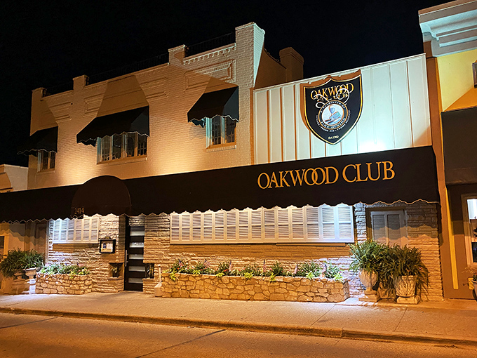 Welcome to flavor town! The Oakwood Club's exterior promises a night of culinary delights, with its classic charm and inviting glow.