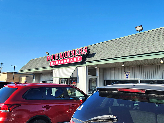 Welcome to Four Korners, where the sign promises good eats and the parking lot hints at local fame. This unassuming exterior hides a treasure trove of comfort food delights!