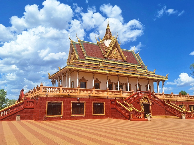 A golden crown jewel in the Minnesota cornfields! This temple's vibrant hues and intricate details make it a feast for the eyes.