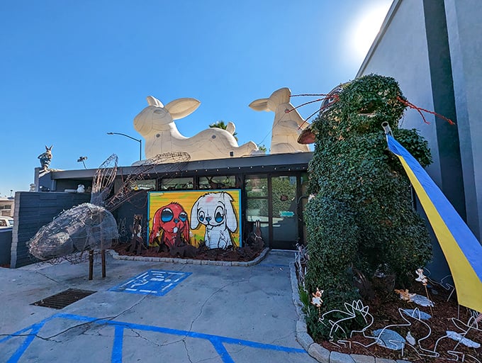 Welcome to bunny paradise! This whimsical wonderland looks like the Easter Bunny's summer home, complete with a giant rabbit guardian perched on the roof.