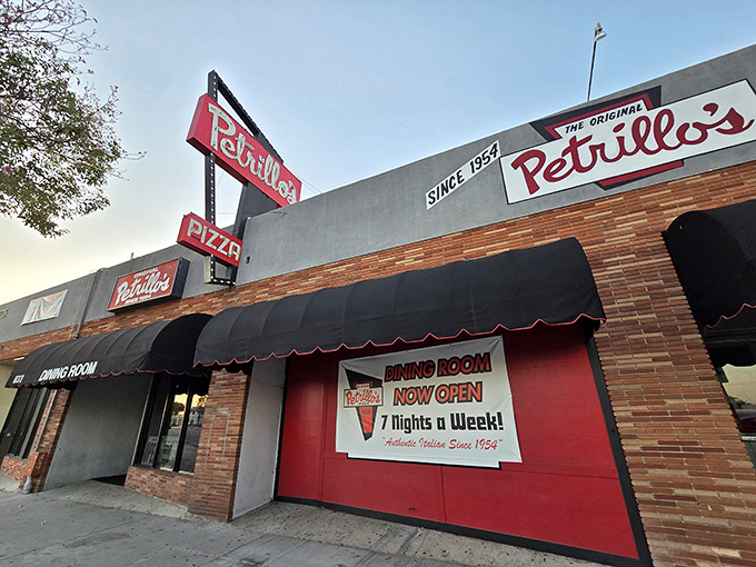 Step into a time machine disguised as a pizzeria! Petrillo's sign has been beckoning pizza lovers since 1954, proving that some things never go out of style.