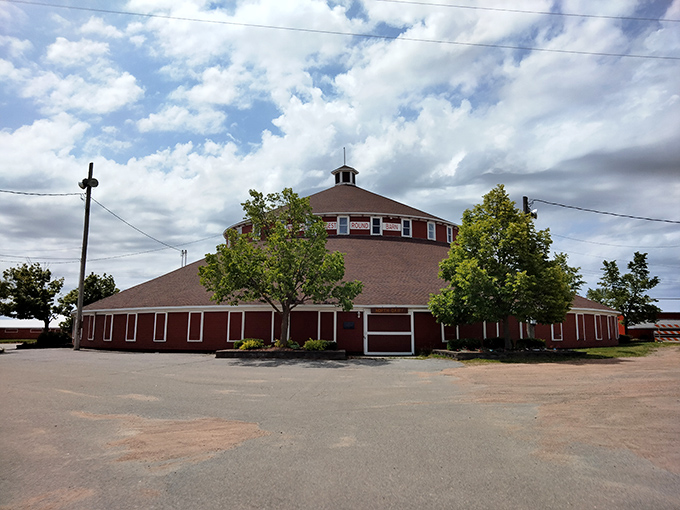 Round and proud, this barn stands tall! It's like the Colosseum of agriculture, minus the gladiators and with more hay.