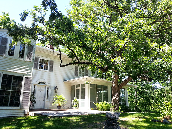 A storybook come to life! This charming white house in Anoka isn't just a pretty facade - it's the gateway to a wonderland of whimsy and delectable treats.