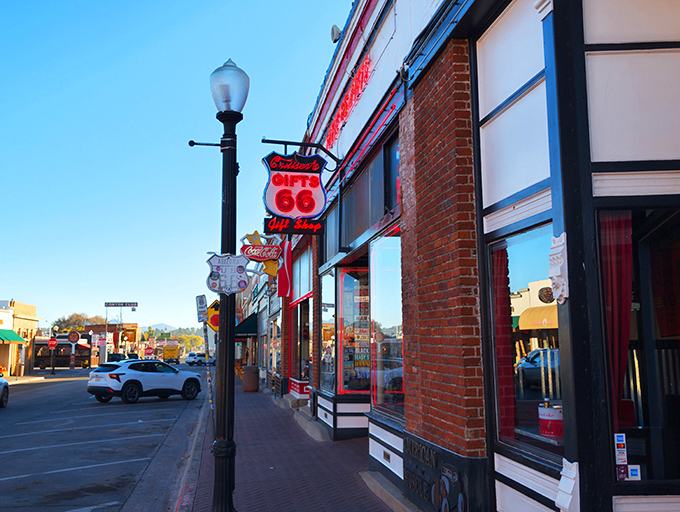 Route 66 nostalgia on steroids! This diner's exterior is a time-traveling feast for the eyes, complete with a cherry-red classic car that's ready to cruise right off the roof.