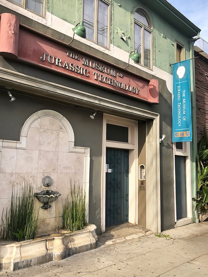"Welcome to Wonderland!" This mint-green facade with its arched windows and quirky fountain is your portal to a world of delightful absurdity.