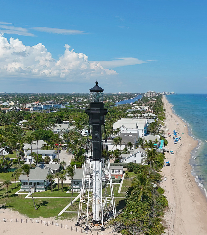 Postcard-perfect paradise! The Hillsboro Inlet Lighthouse stands tall, guarding a slice of Florida heaven that'd make even Jimmy Buffett want to change his latitude.