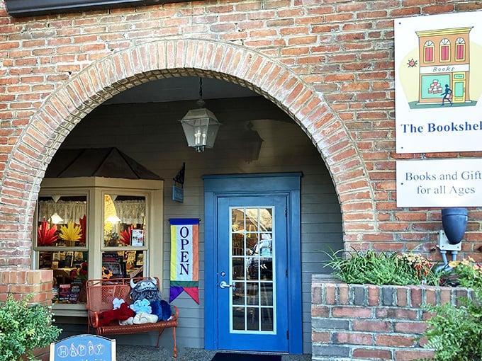 Step into a literary wonderland! The Bookshelf's charming brick facade and bright blue door beckon bookworms like a siren's call to bibliophilic bliss.