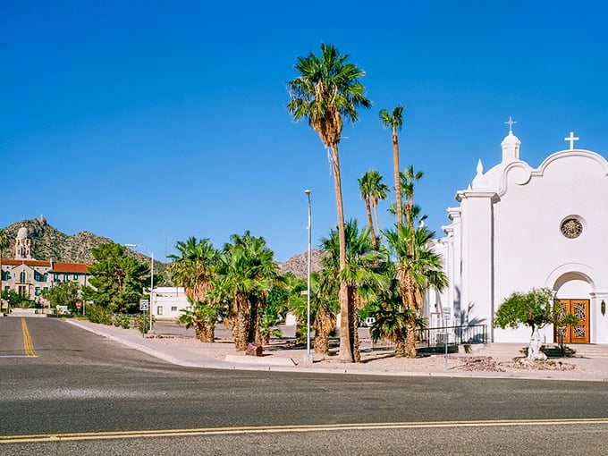 "Holy guacamole, it's a desert oasis!" Palm trees and a pristine white church create a scene straight out of a spaghetti western meets Spanish colonial dream. Ajo's town center is ready for its close-up.