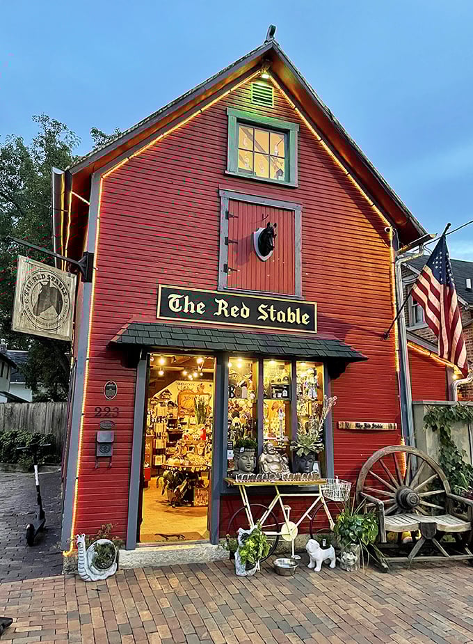 A barn-red beacon of whimsy! The Red Stable stands proud, its vibrant exterior promising a treasure trove of delights within. Step inside and let the adventure begin!