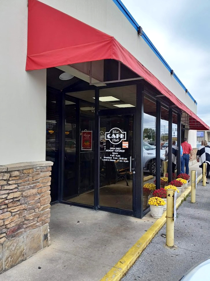 A blue-trimmed beacon of breakfast bliss! This unassuming exterior hides a treasure trove of Southern comfort food that'll make your taste buds dance.