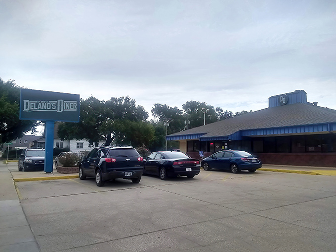 A blue beacon of breakfast bliss! Delano's Diner stands ready to satisfy your morning cravings, like a lighthouse guiding hungry sailors to shore.