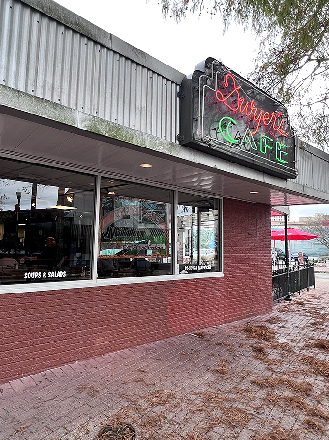 A neon sign that could guide hungry sailors home! Dwyer's Cafe stands proud, a brick-and-mortar beacon of breakfast bliss in downtown Lafayette.