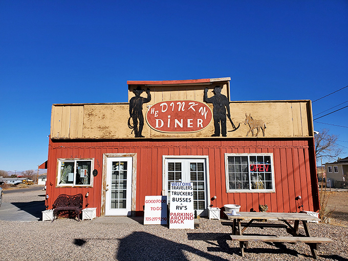 Welcome to the Dinky Diner, where big flavors come in small packages! This charming red exterior is like a beacon of comfort food in the Nevada desert.