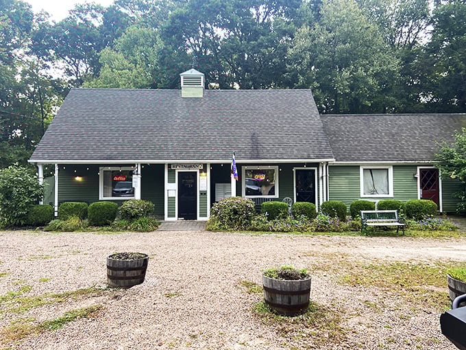 A cozy green haven beckons! The Hungry Haven's exterior is like a warm hug from your favorite aunt, complete with charming flower beds and a welcoming atmosphere.