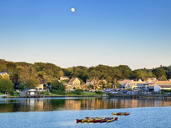 This view showcases the town's picturesque charm, with stunning foliage framing the tranquil waters and quaint buildings.