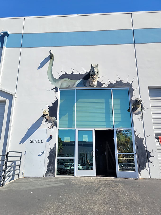 "Welcome to Jurassic Park&hellip; er, Lost Worlds Adventures!" This eye-catching entrance sets the stage for prehistoric thrills, with a dino bursting through the wall like an overeager party crasher.