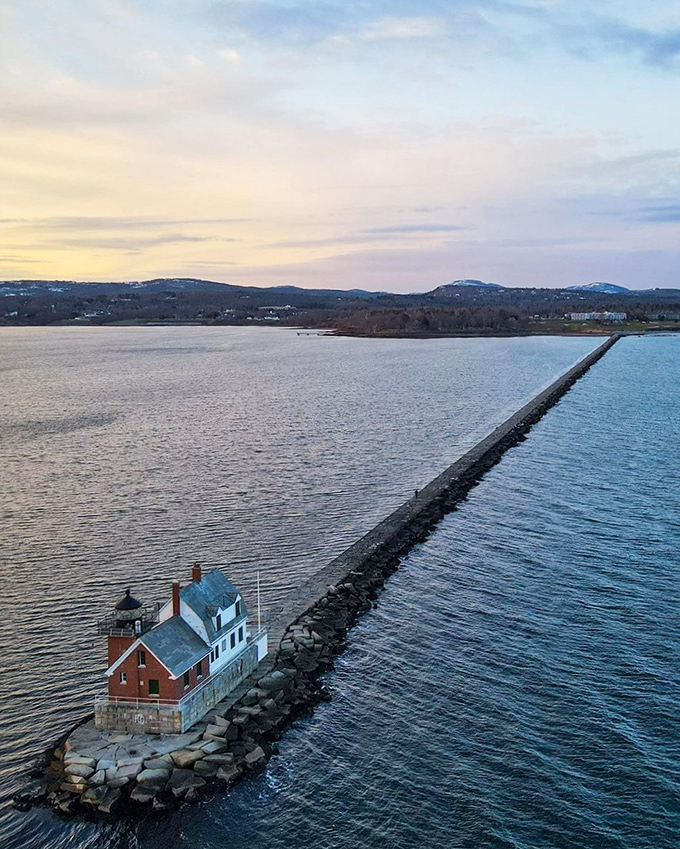 A lighthouse at the end of the world? Nope, just Maine's own slice of maritime magic, standing guard over Penobscot Bay like a sentinel of the sea.