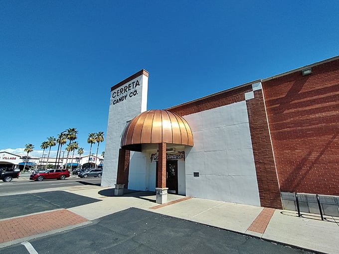 Welcome to candy paradise! Cerreta Candy Company's copper-domed entrance beckons like a sweet siren call, promising sugary delights within its unassuming brick walls.