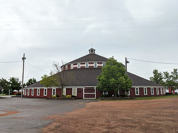 Round and proud, this barn stands tall! It's like the Colosseum of agriculture, minus the gladiators and with more hay.