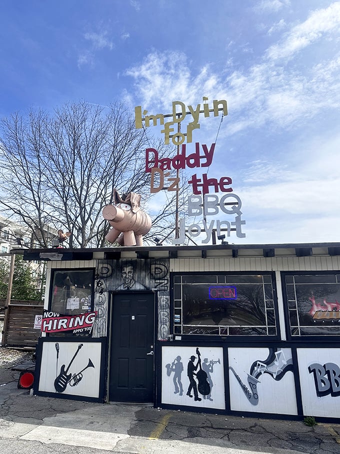 Welcome to BBQ wonderland! Daddy D'z exterior is a feast for the eyes, with its quirky signage and pink pig guardian. It's like Willy Wonka opened a smokehouse!