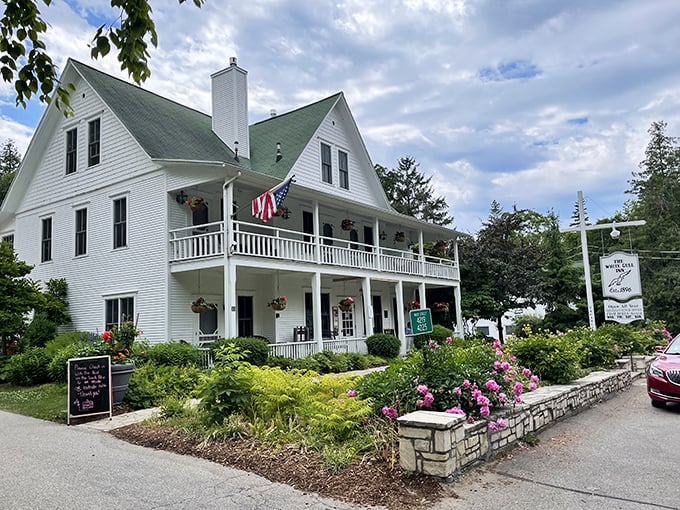 A postcard-perfect welcome: The White Gull Inn's charming facade and vibrant flower beds invite you to step into a world where relaxation reigns supreme. 