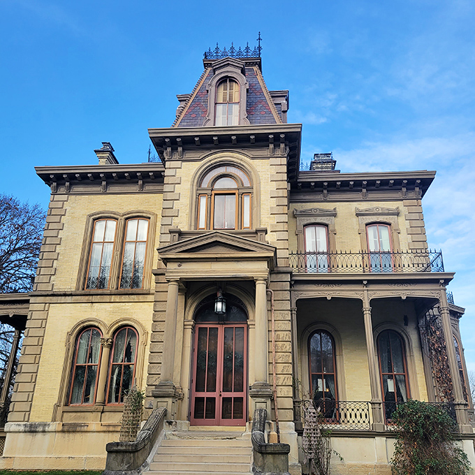 Behold, the architectural equivalent of a Victorian power suit! This brick beauty stands tall, daring you to step into its time-warping embrace.