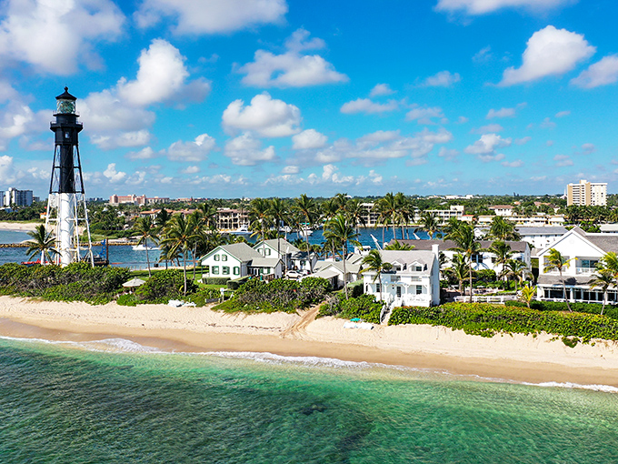 Postcard-perfect paradise! The Hillsboro Inlet Lighthouse stands tall, guarding a slice of Florida heaven that'd make even Jimmy Buffett want to change his latitude.