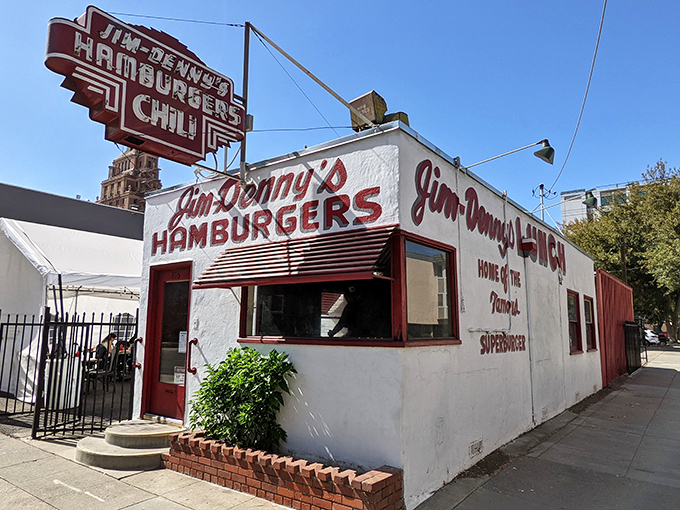 A time machine disguised as a diner! Jim Denny's iconic facade stands proud, its retro sign a beacon for hungry time travelers seeking a taste of nostalgia.