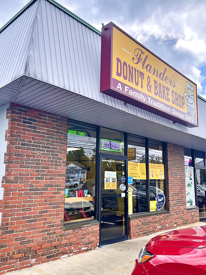 Welcome to donut paradise! Flanders Donut & Bake Shop's cheery yellow sign promises a family tradition of sweet delights since 1972.