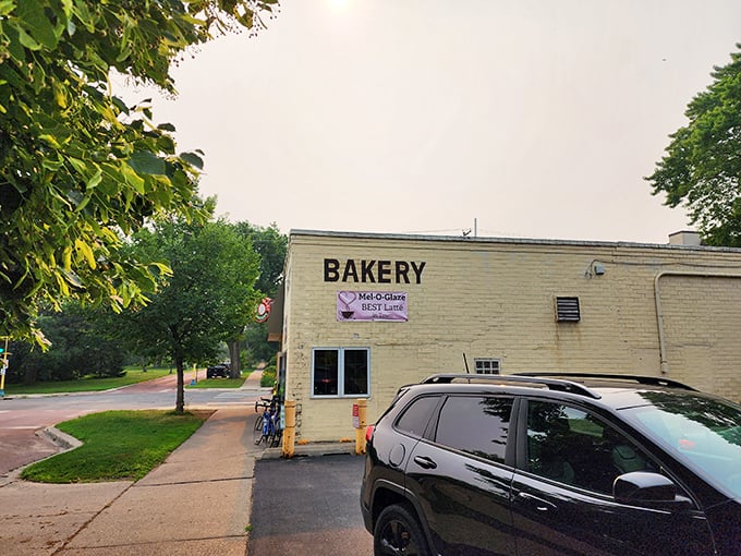 A yellow beacon of sugary salvation! Mel-O-Glaze Bakery stands unassumingly on the corner, its retro sign promising sweet delights within. It's like stumbling upon Willy Wonka's secret Midwest outpost.