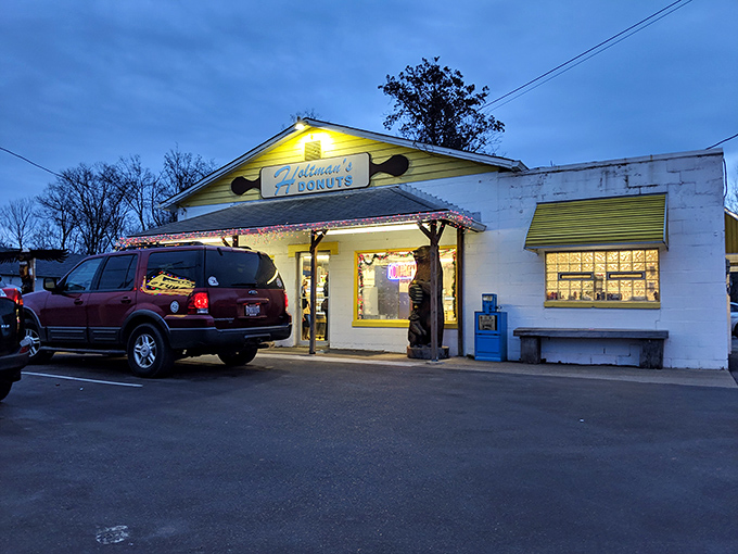 A beacon of sweetness in the night! Holtman's exterior glows like a sugary lighthouse, guiding donut lovers to their delicious destiny.