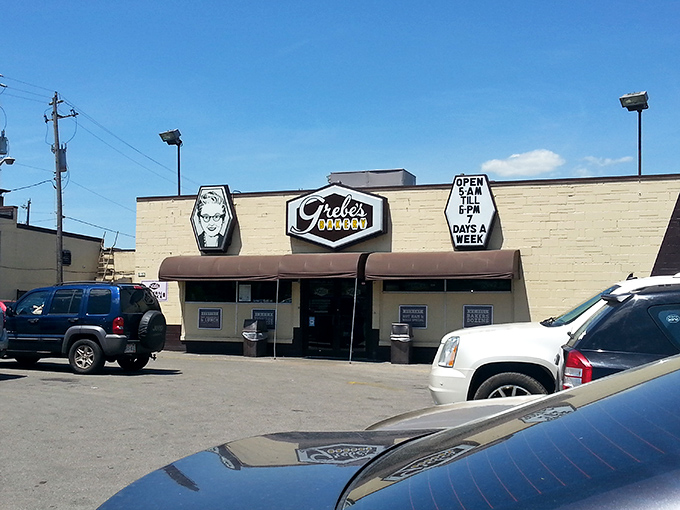 Welcome to carb heaven! Grebe's Bakery's retro sign beckons like a sugary siren, promising delights that would make even the Pillsbury Doughboy jealous.