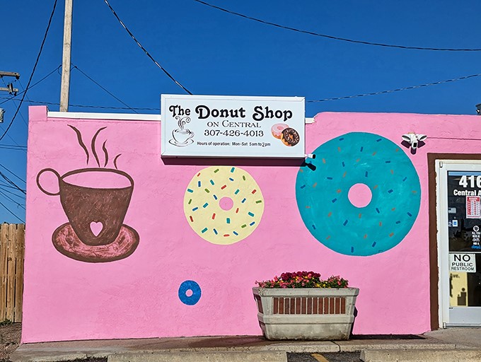 A pink paradise that's more eye-catching than a rodeo clown! This donut shop's exterior is a delightful feast for the eyes and a promise of sweet treats within.