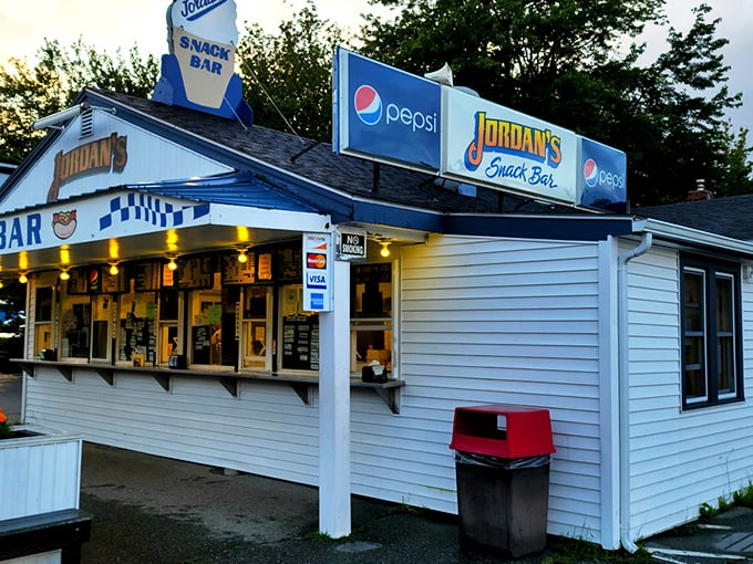 A slice of Americana with a side of seafood! Jordan's Snack Bar beckons with its classic white exterior and promise of lobster-filled dreams.