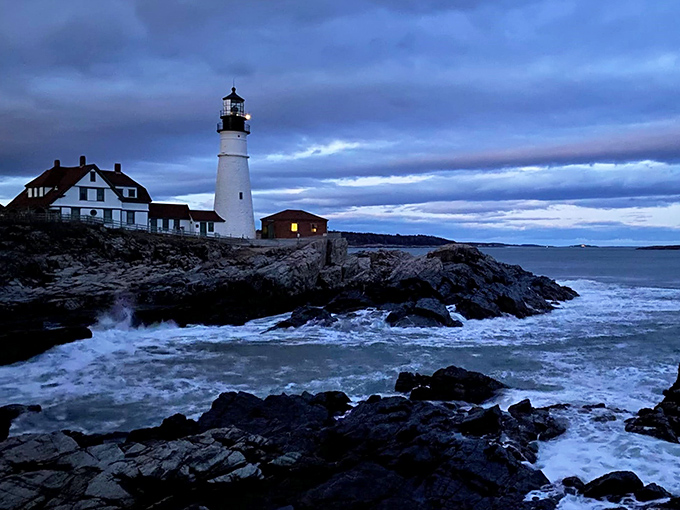 A postcard-perfect scene: Pemaquid Point Lighthouse stands sentinel, its white tower a beacon of hope against the azure Maine sky.