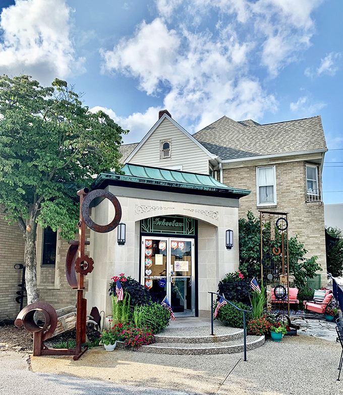 Welcome to Skeleton Key, where time travel is just a doorknob turn away! This charming facade hints at the treasures within, complete with a rusty sculpture that's part modern art, part conversation starter.