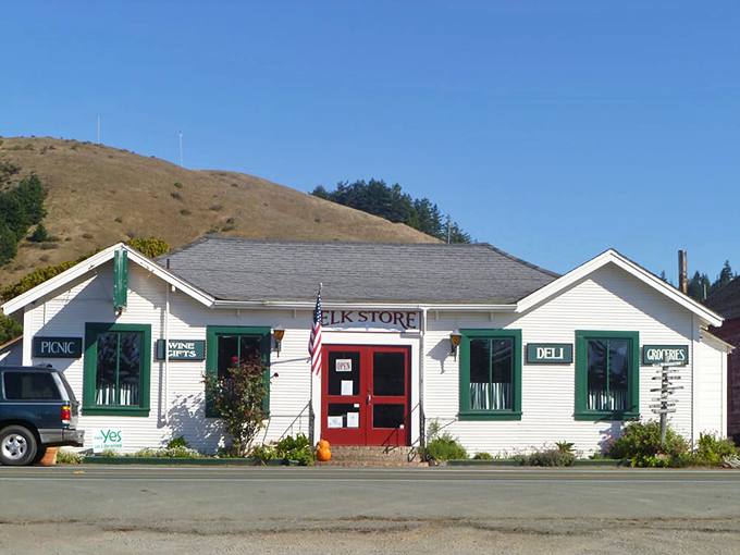 Welcome to the Elk Store, where Norman Rockwell meets gourmet sandwiches. This charming white building with its red door is like a beacon of deliciousness in the California countryside.