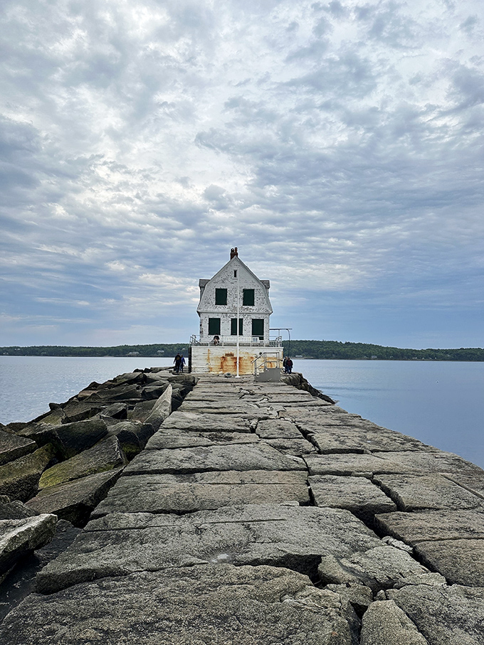 A lighthouse at the end of the world? Nope, just Maine's own slice of maritime magic, standing guard over Penobscot Bay like a sentinel of the sea.