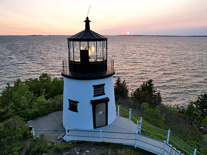 Twilight's embrace: Where sea meets sky, Owls Head Lighthouse stands sentinel, its beacon a promise of safe harbor and untold stories.