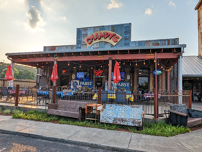 Rustic charm meets Southern hospitality! Champy's exterior beckons with its weathered wood, twinkling lights, and promise of finger-lickin' goodness inside.