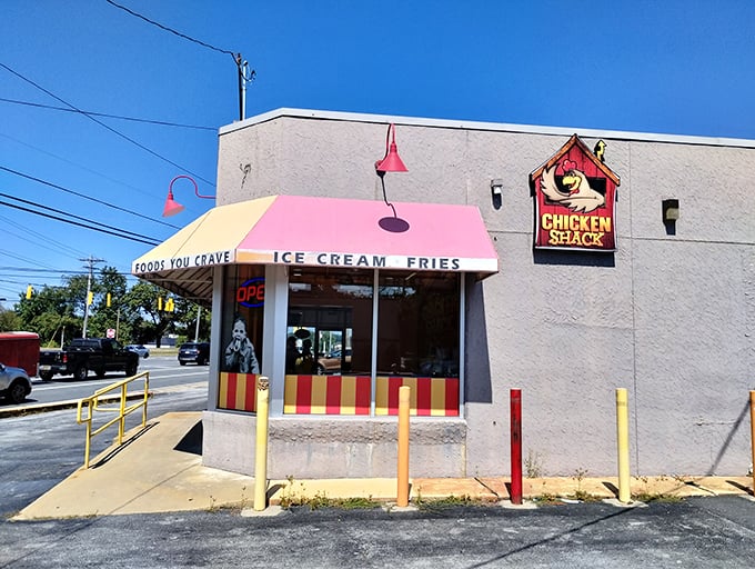 Welcome to flavor town! Johnnie's Dog House and Chicken Shack beckons with its cheerful awning and promise of comfort food that'll make your taste buds do a happy dance.