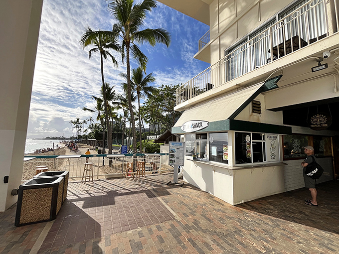 Surf's up, and so is your appetite! The Steak Shack's surfboard sign promises waves of flavor just steps from Waikiki Beach.