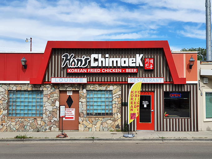 Welcome to chicken paradise! Han's Chimaek's bold red awning and stone facade promise a flavor explosion waiting inside.