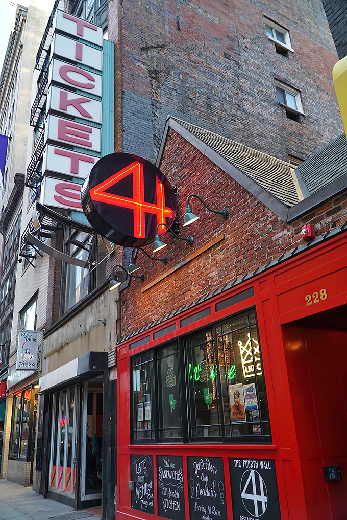 A neon beacon in the night, 4th Wall's red door beckons like a culinary Bat-Signal. Who needs the Batcave when you've got this?