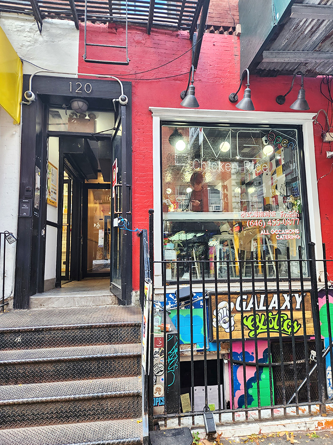 A splash of red in the urban jungle! This vibrant storefront promises a chicken adventure that'll ruffle your feathers in the best way possible.