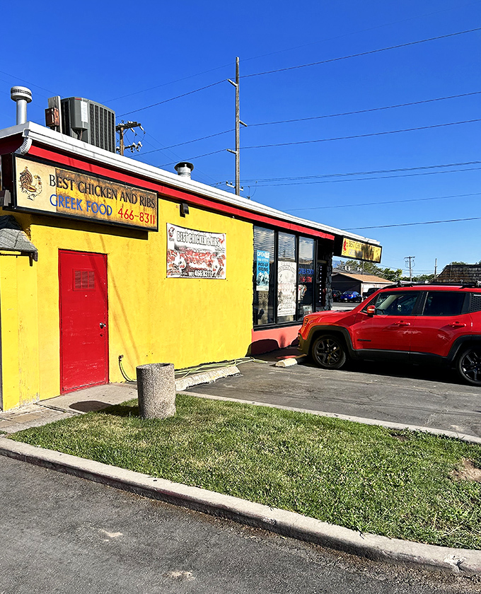 Sunshine on a plate! This vibrant yellow building with its bold red door is like a beacon for hungry souls in Salt Lake City.